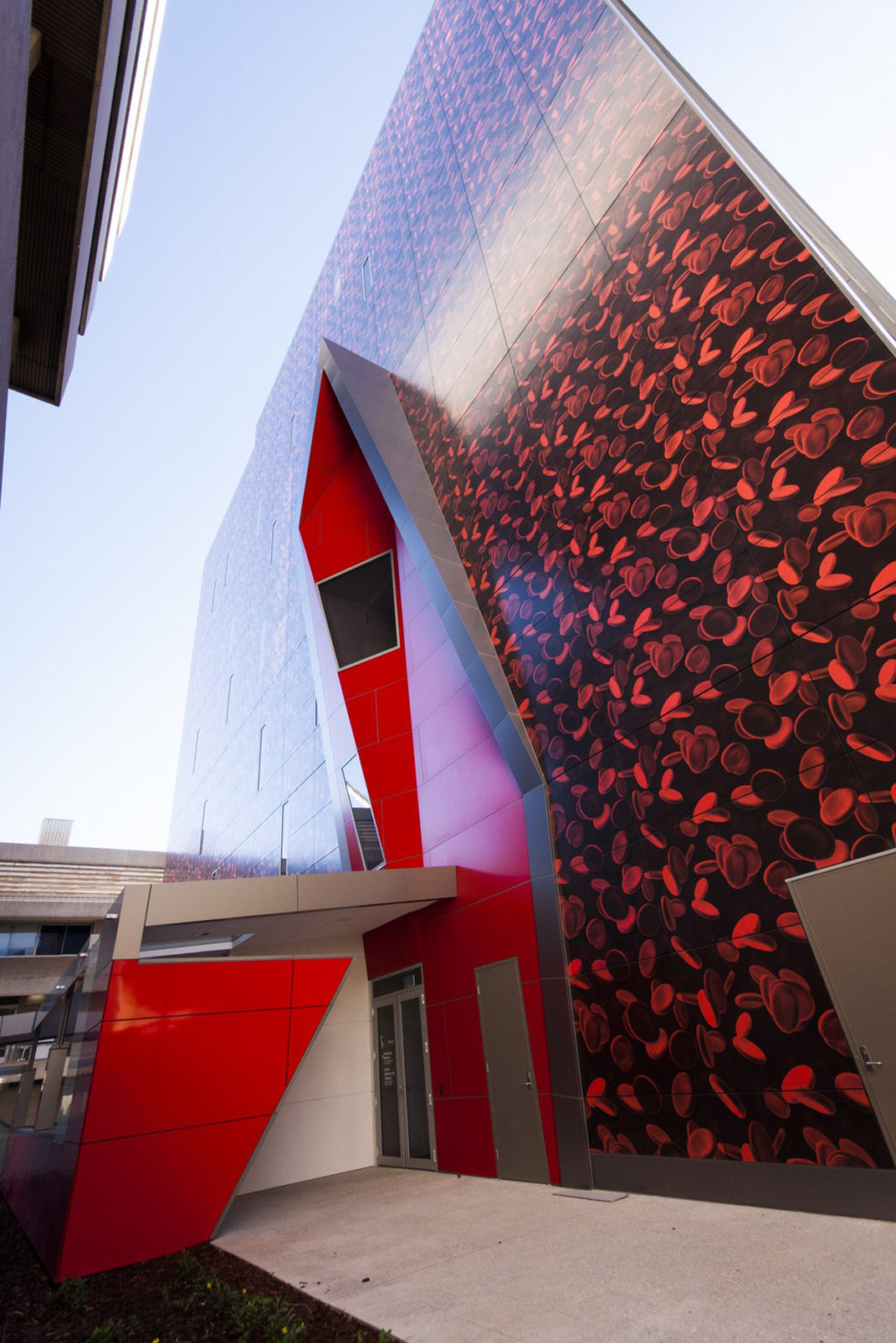 Striking Red Blood Cell Pattern Printed Over Medical Facility Façade ...
